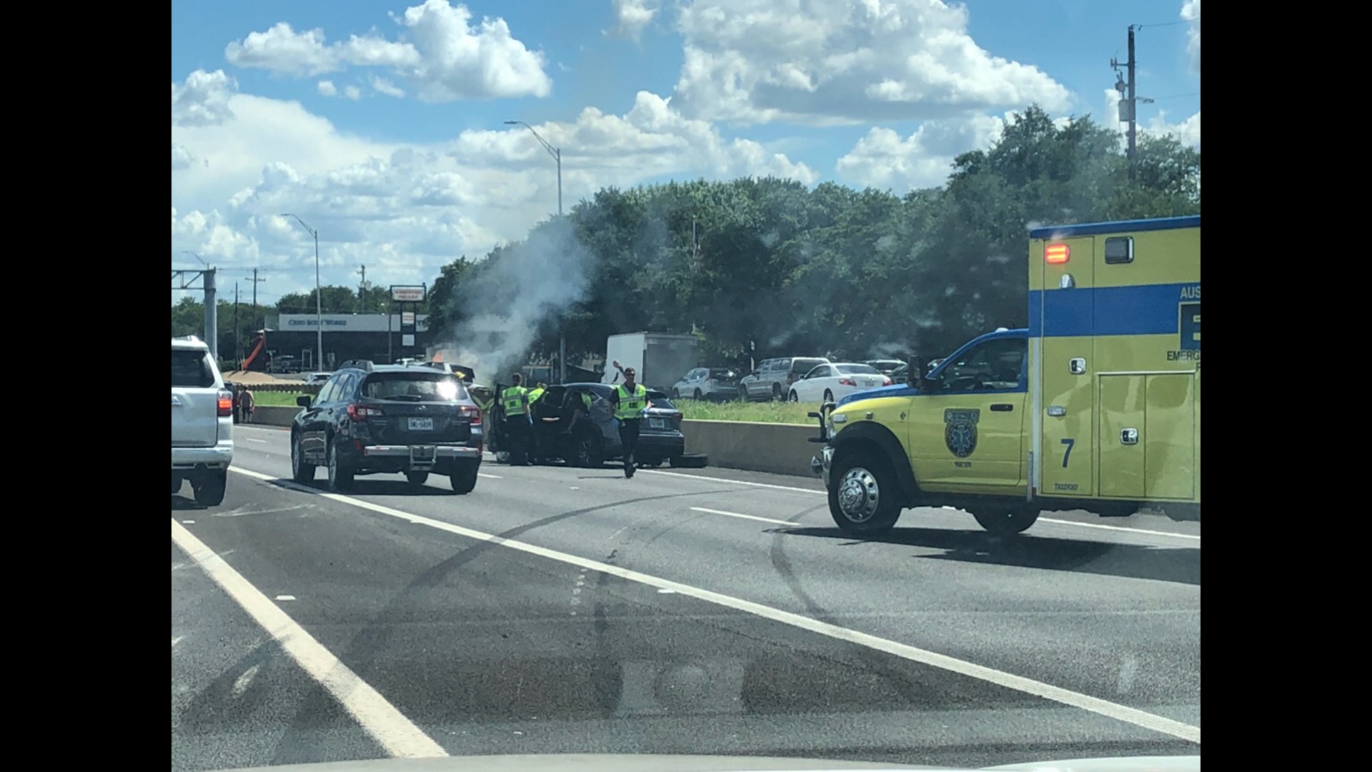 Car flipped over guardrail, caught on fire, officials say | kvue.com