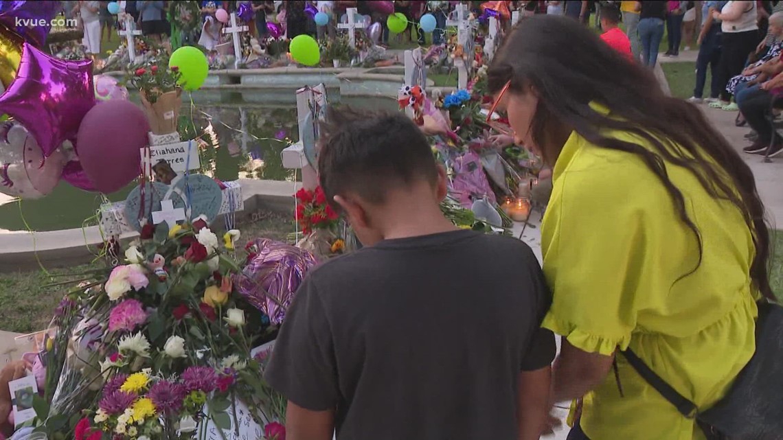 Memorials to remember shooting victims filled with flowers, candles in ...