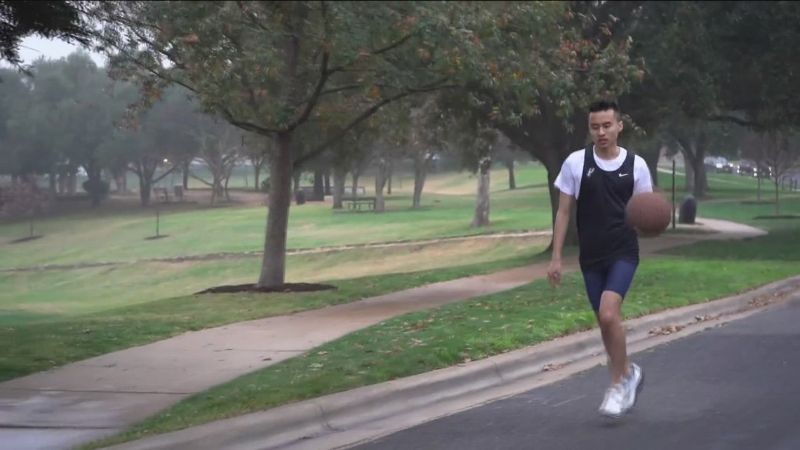 Runner attempts to achieve world record for dribbling a basketball ...