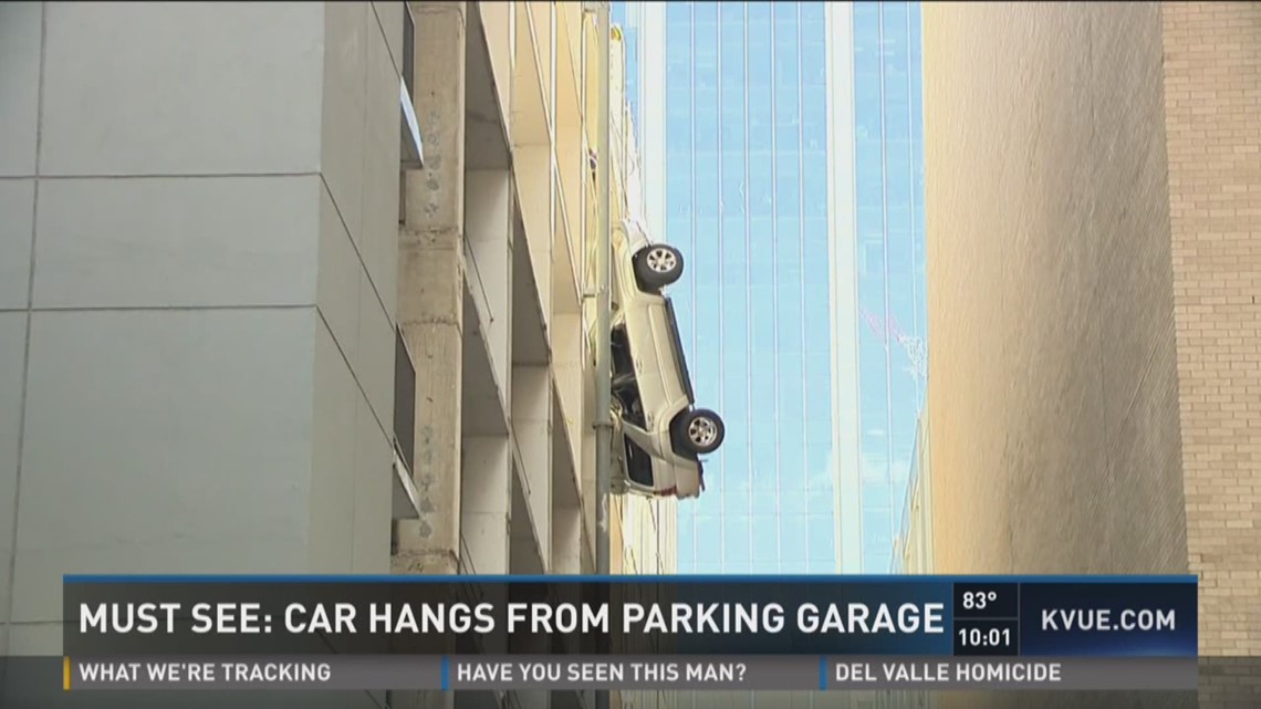 Must see: Car hangs from parking garage | kvue.com