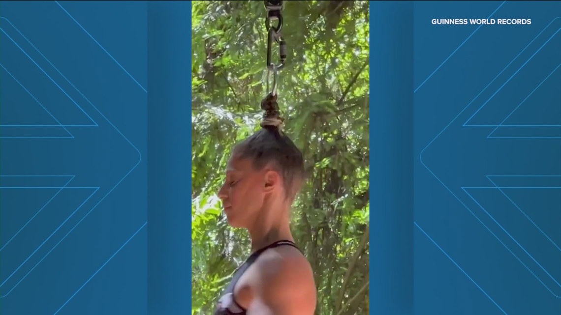 Circus performer breaks world record for hair hanging | kvue.com