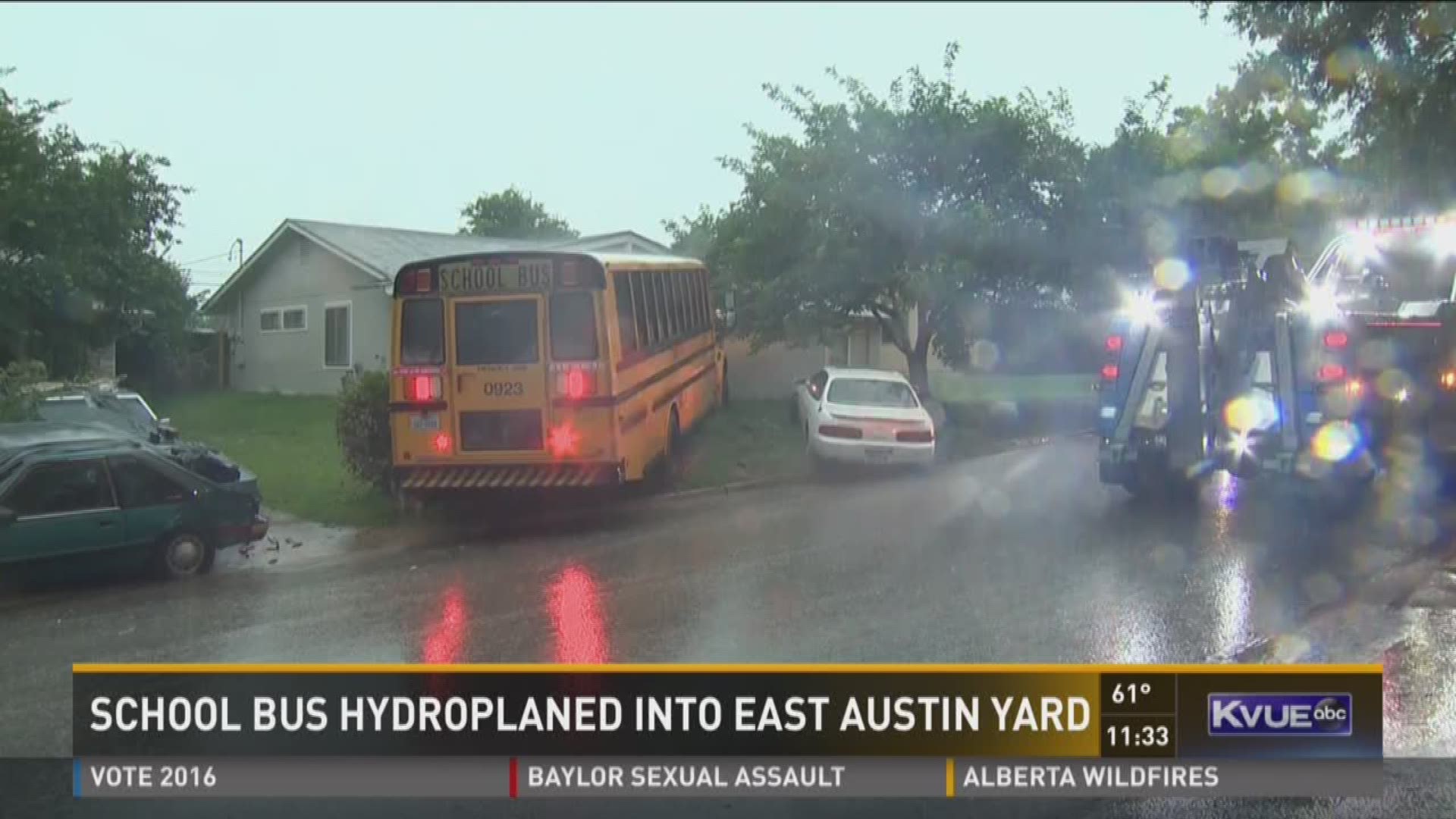 APD: School bus hydroplaned, landed in East Austin front yard | kvue.com