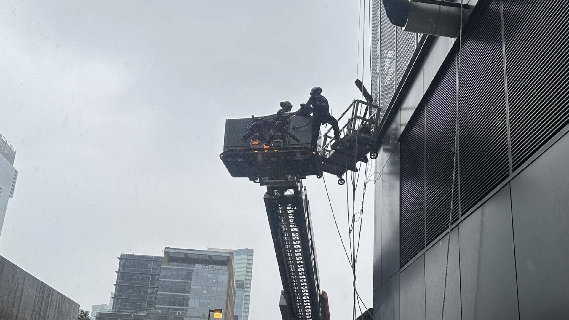 Austin fire crews rescue window washer on Guadalupe Street | kvue.com