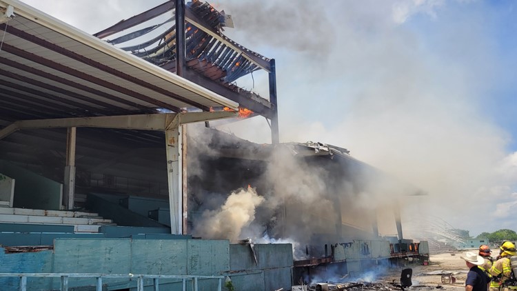 Fire crews putting out flames at grandstand in Manor | kvue.com