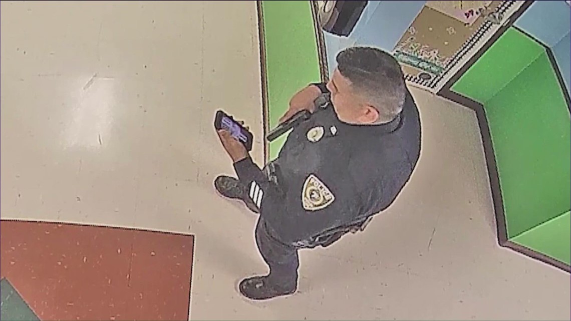Officer on phone in Robb Elementary hallway was trying to contact wife ...