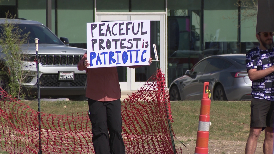 Protesters rally outside Tesla showroom in Austin for second straight ...